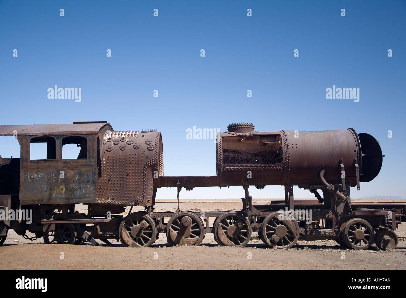 Rusty train in the Uyuni train cemetary in bolivia Stock Photo - Alamy
