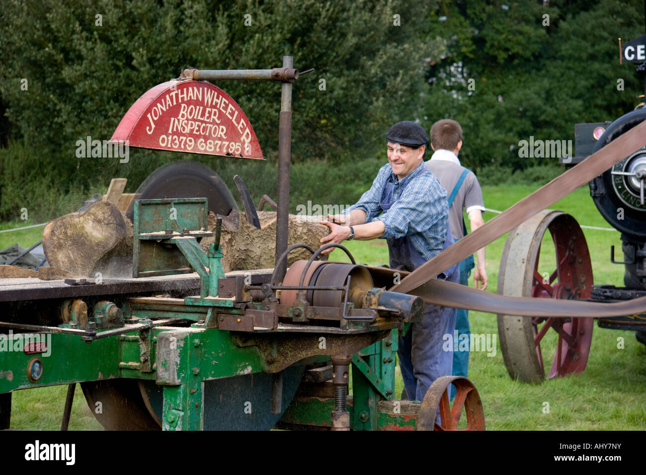 Men operating a steam powered wood saw Stock Photo - Alamy