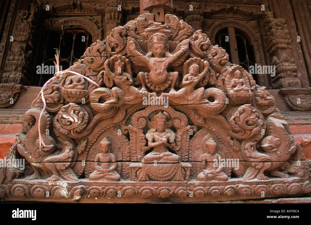Rich wood carved religious scene Newari Style in Kathmandu Valley Nepal ...