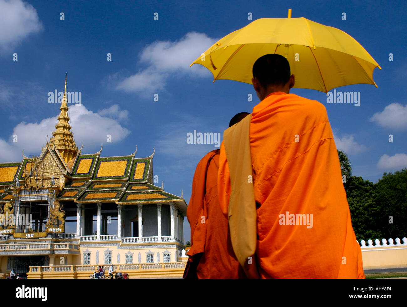 Novice monks walk in front of the Royal Palace in Phnom Penh Cambodia ...