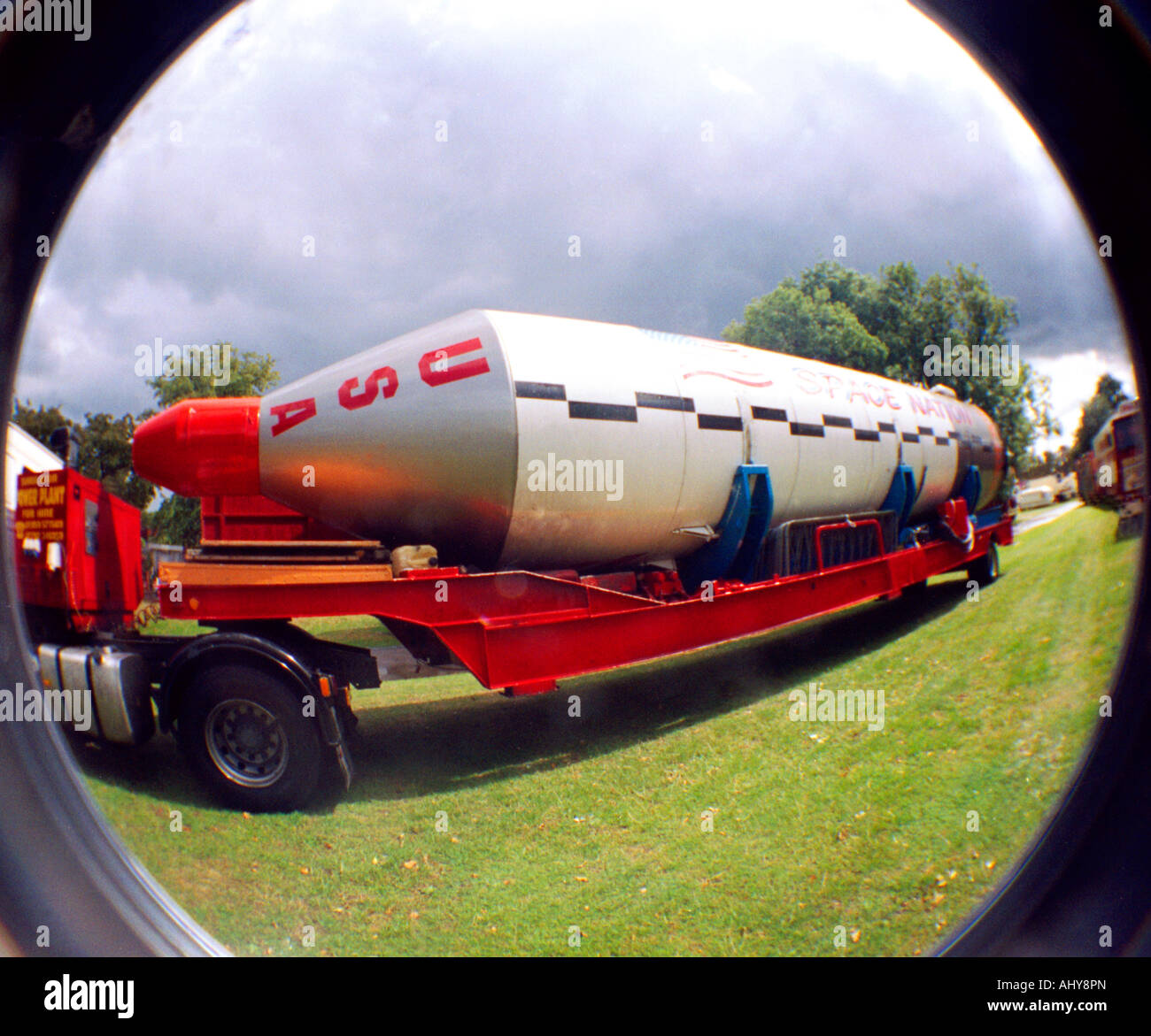 rocket style fairground ride on trailer in London park fisheye Stock ...