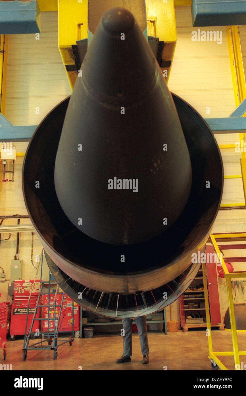 Aero engineer working on a jet engine at a service facility in the UK ...