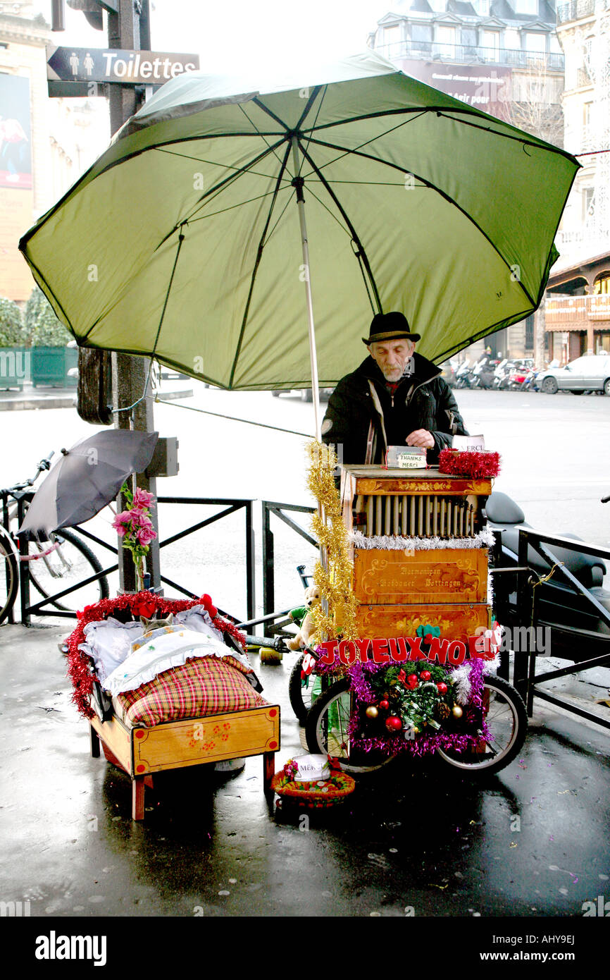 organ grinder on street in Paris Stock Photo - Alamy