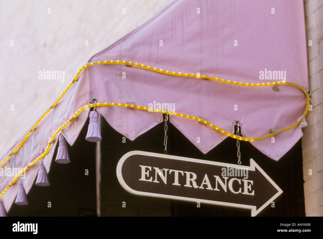 entrance sign poster arrow pink color awning restaurant Stock Photo - Alamy