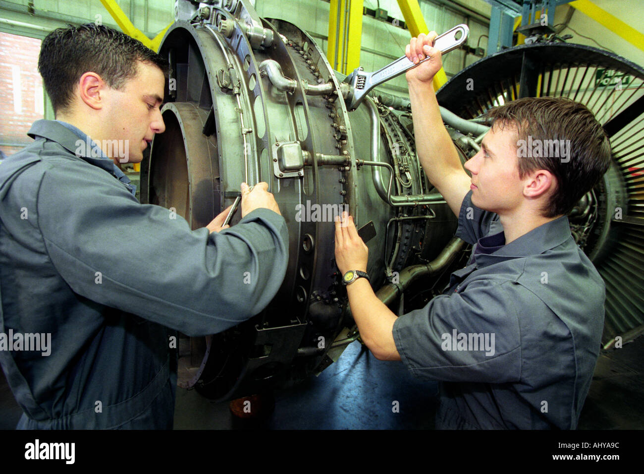 Modern Apprentices working on an aircraft jet engine UK Stock Photo - Alamy