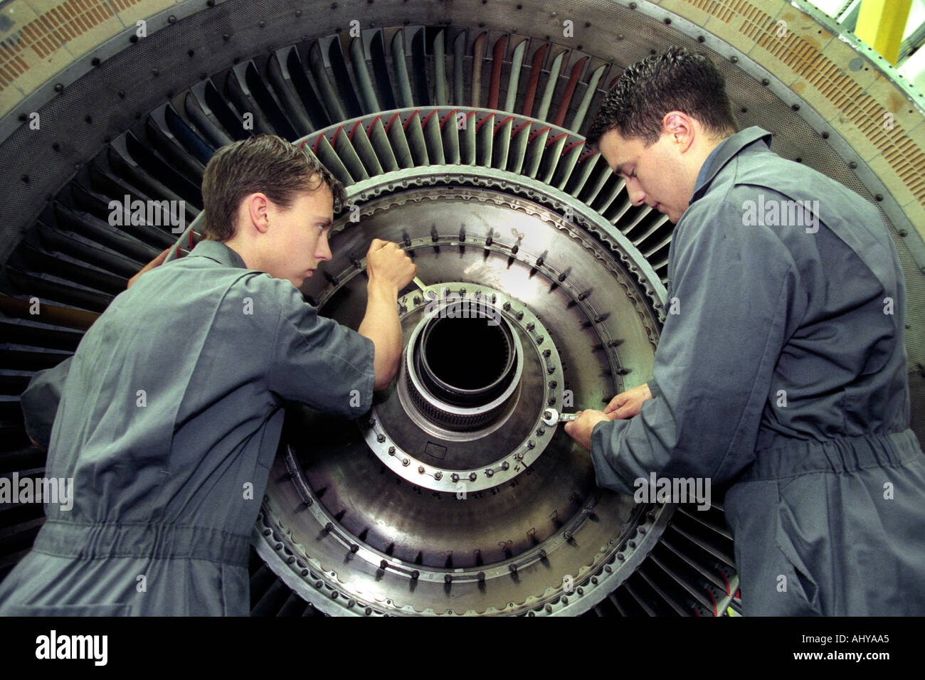 Modern Apprentices working on an aircraft jet engine UK Stock Photo - Alamy