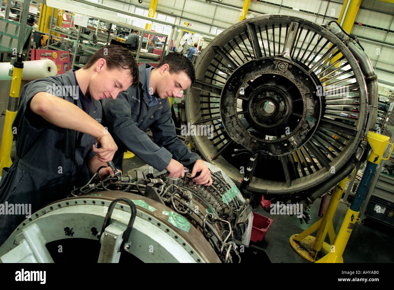 Modern Apprentices working on an aircraft jet engine UK Stock Photo - Alamy