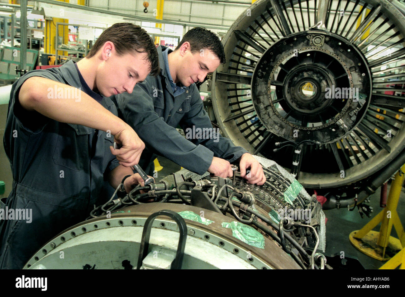 Modern Apprentices working on an aircraft jet engine UK Stock Photo - Alamy