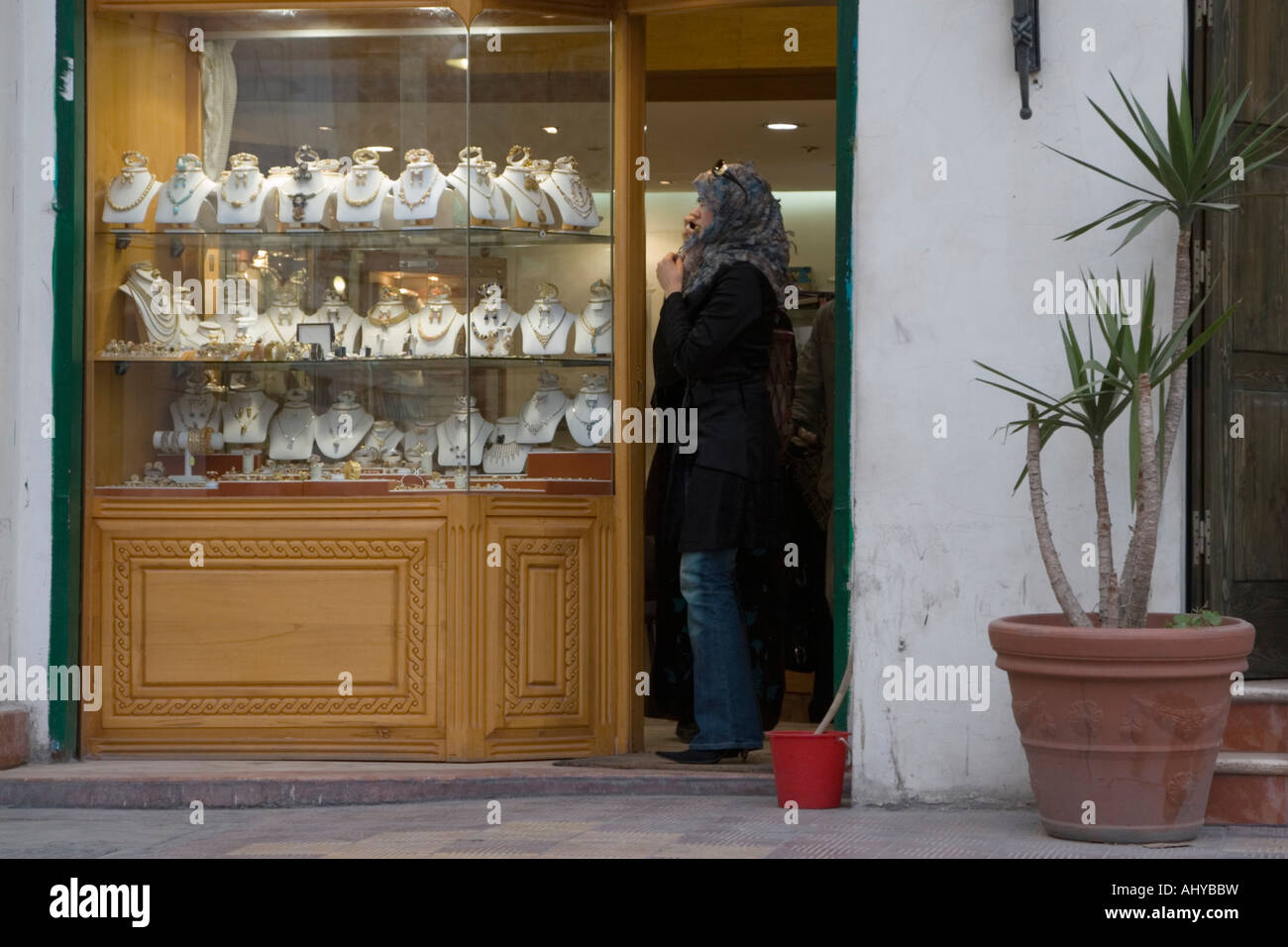 Tripoli, Libya. Libyan Woman in Jeans Looking at Jewelry Necklaces ...