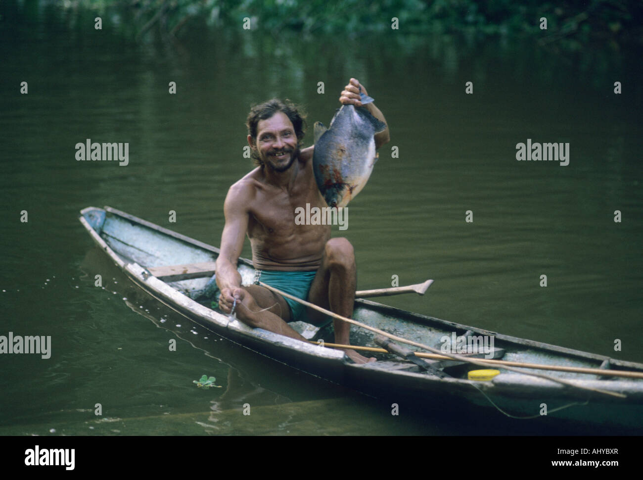 Caboclo fisherman with catch, Amazon River Brazil Stock Photo - Alamy
