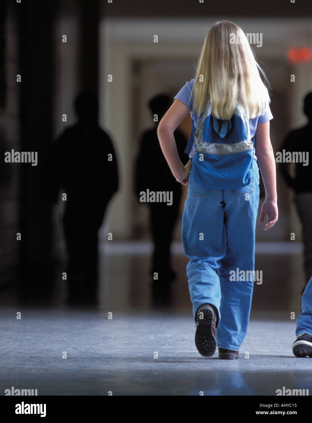 Girl walking down hallway hi-res stock photography and images - Alamy