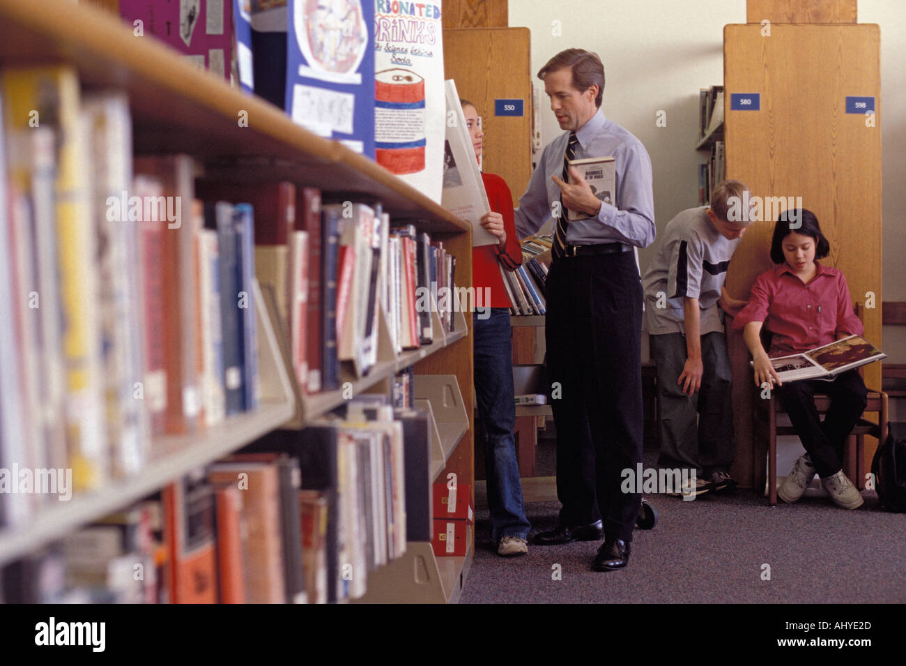 Middle school students library books hi-res stock photography and ...