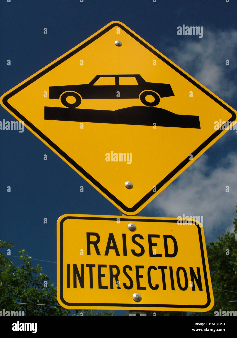 AJD45820, road sign, Raised Intersection Stock Photo - Alamy