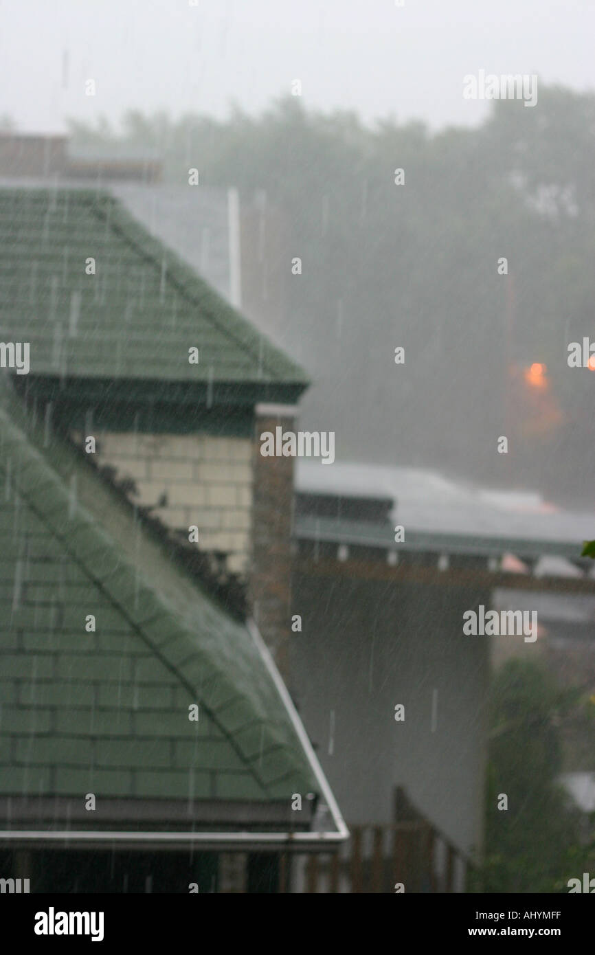 Rain pouring on a rooftop Stock Photo - Alamy