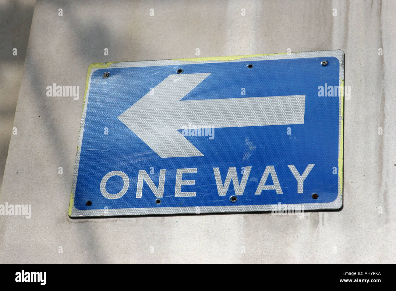 One way direction road sign on wall Stock Photo - Alamy