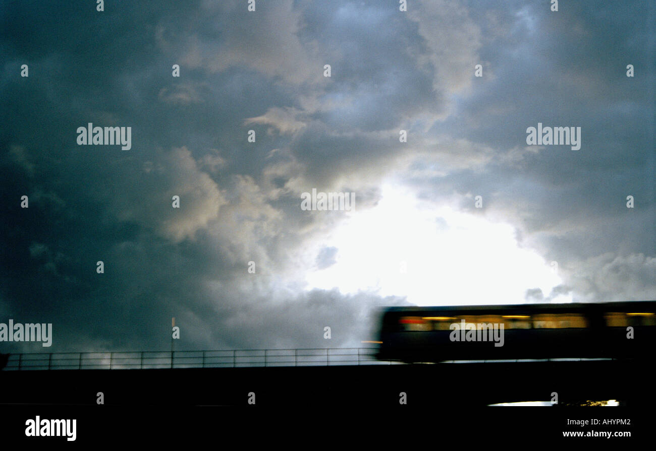 Subway train travelling in the sky. Just passing an hole in the sky ...