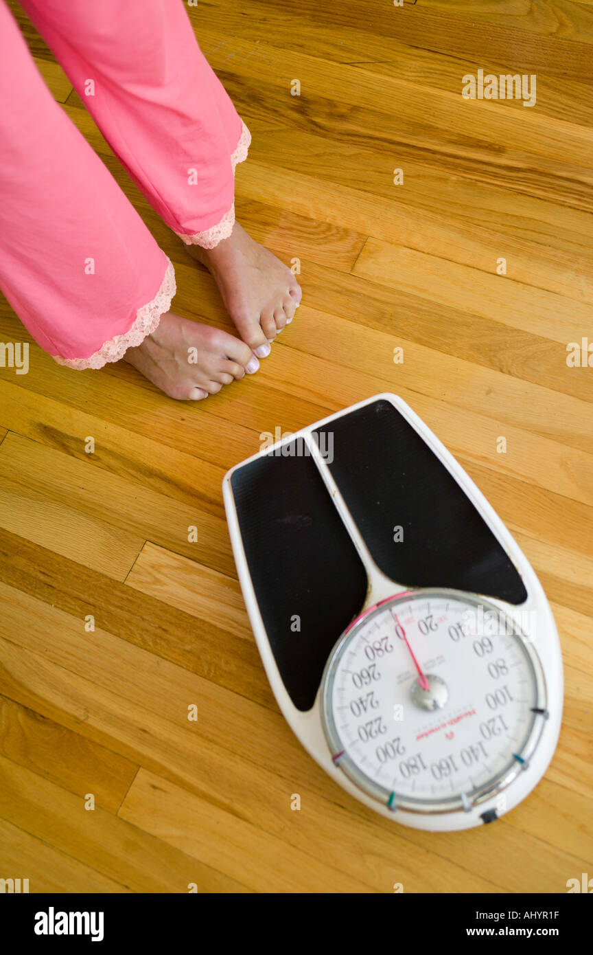 Plump woman scale hi-res stock photography and images - Alamy