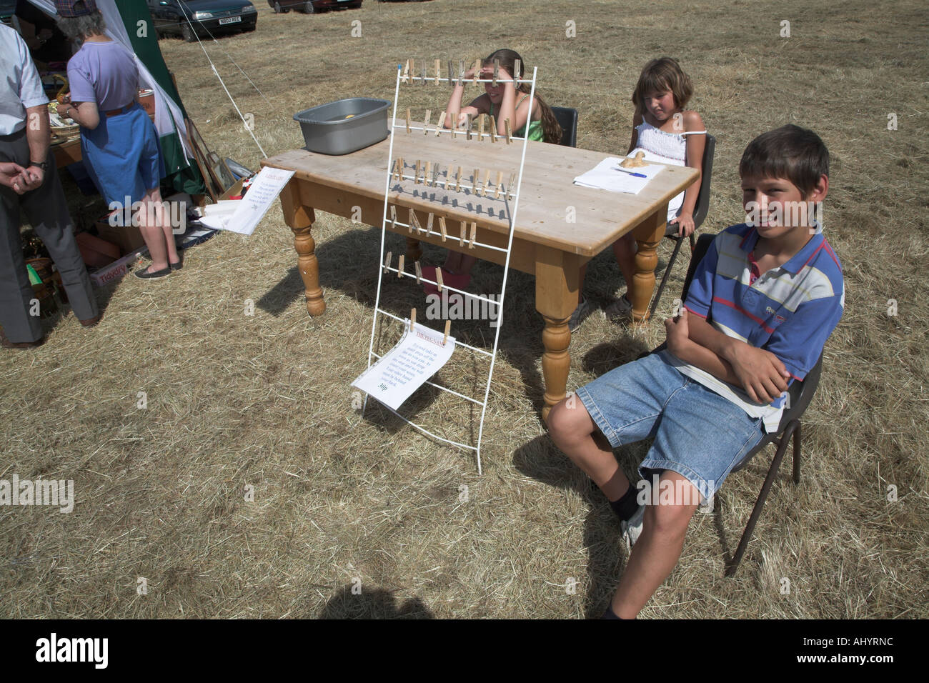 Children running summer fete sideshow game Butley Suffolk England Stock ...