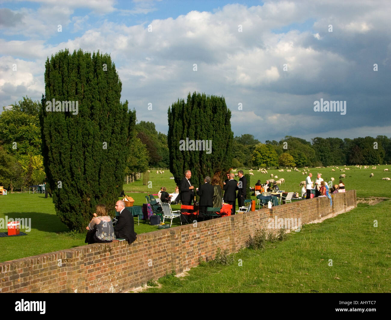 opera lovers in grounds of Glyndebourne opera house Sussex Stock Photo ...