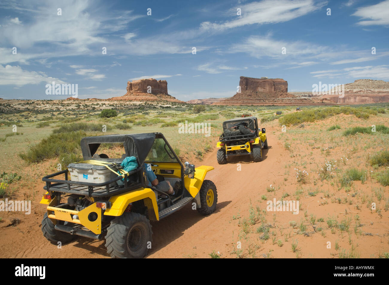 Off-road vehicles driving through desert Stock Photo - Alamy