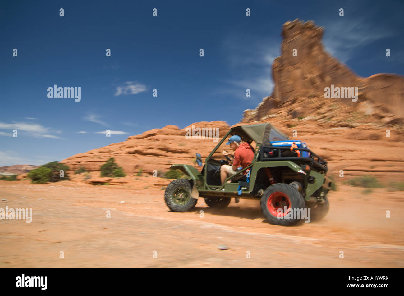 Man driving off-road vehicle in desert Stock Photo - Alamy