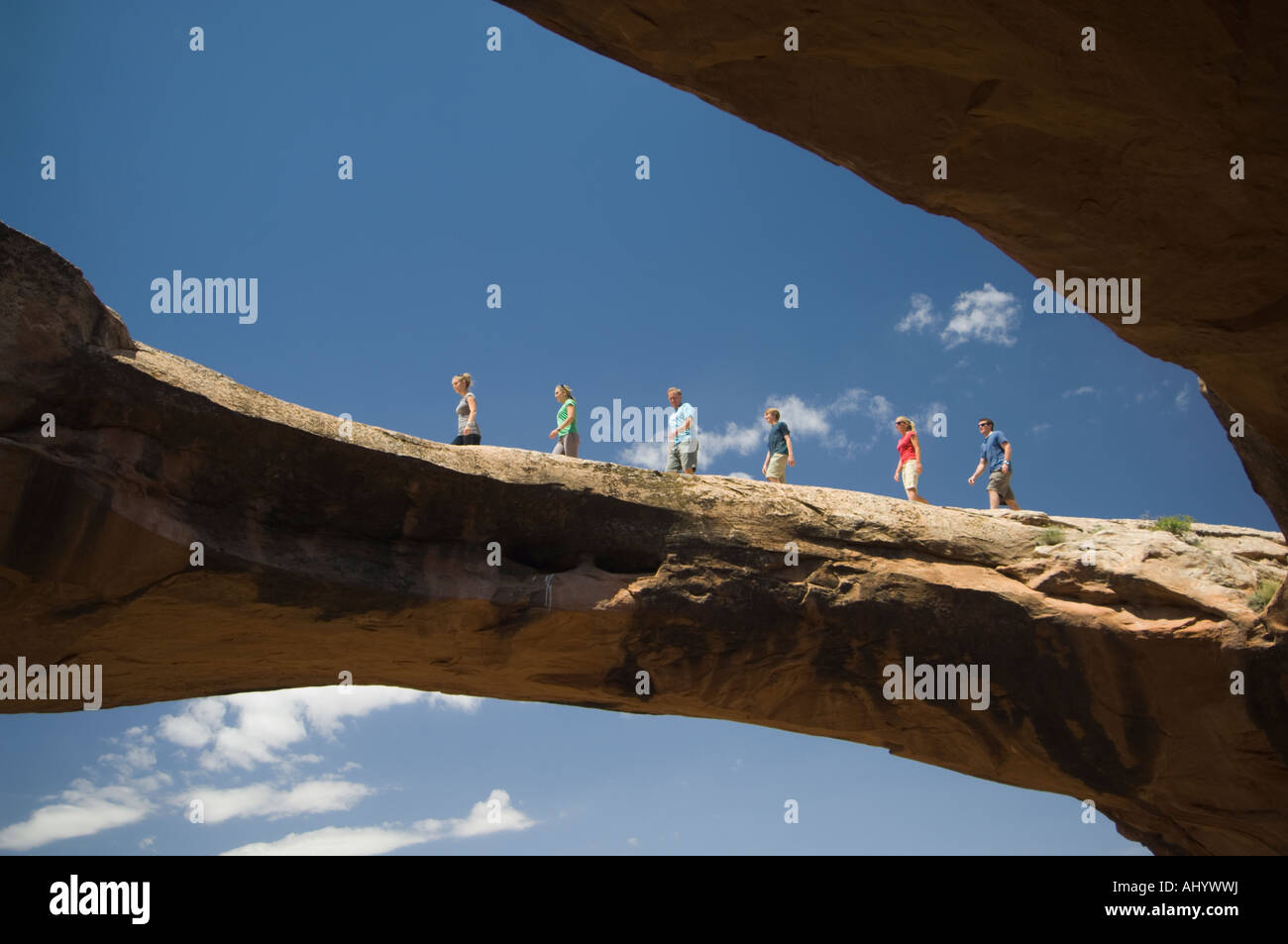 People walking on rock formation Stock Photo - Alamy