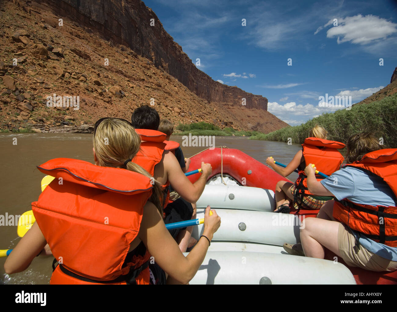 People paddling in raft Stock Photo - Alamy