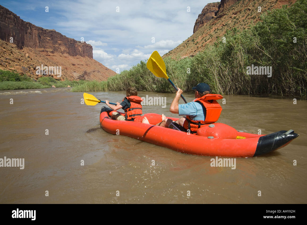 People paddling in raft Stock Photo - Alamy