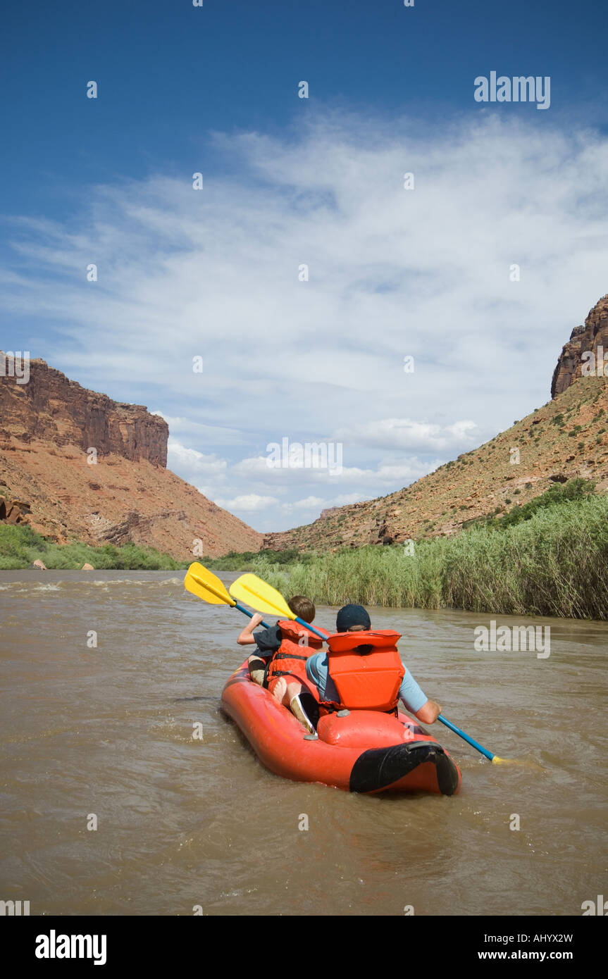 People paddling in raft Stock Photo - Alamy