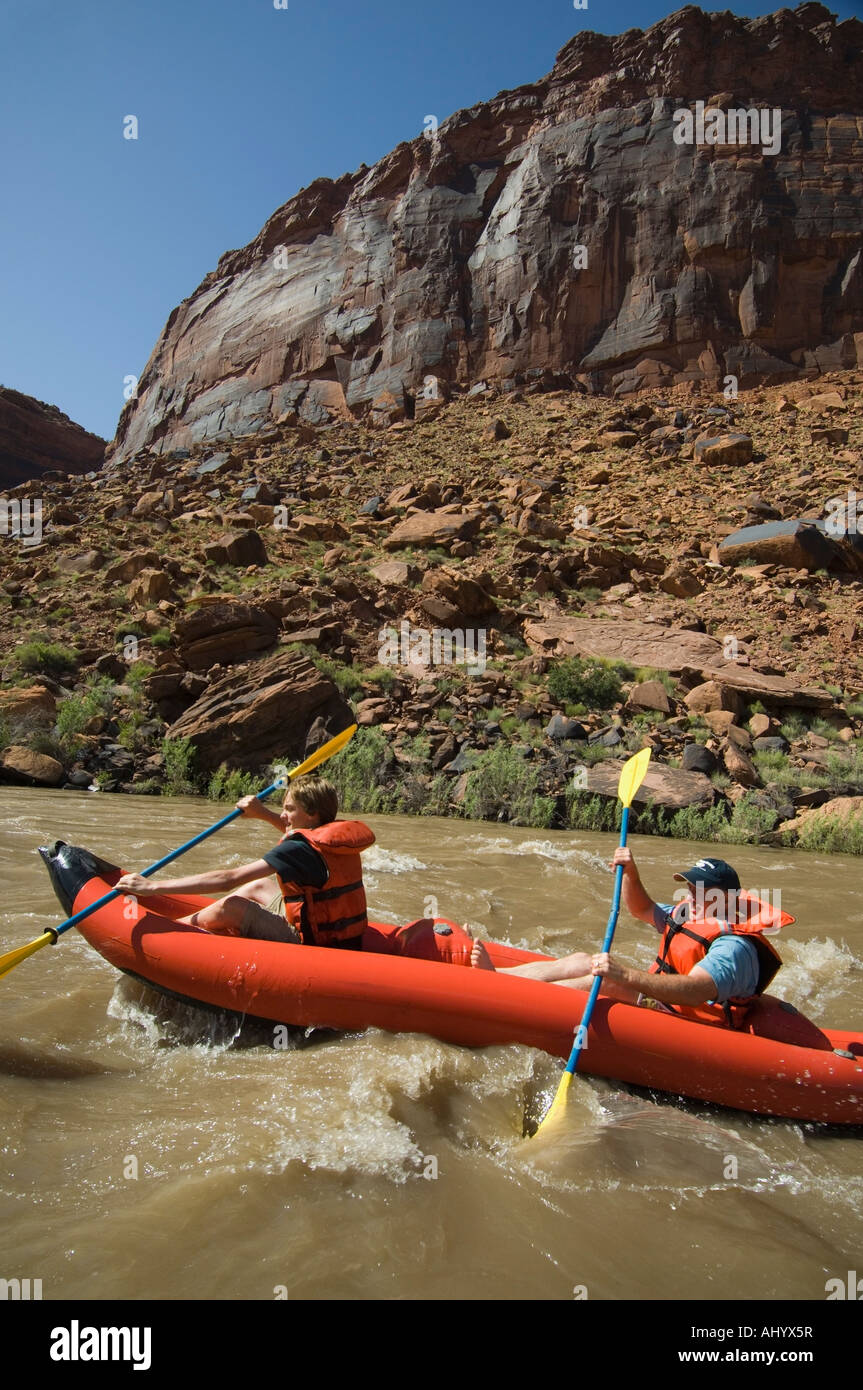 People paddling in raft Stock Photo - Alamy