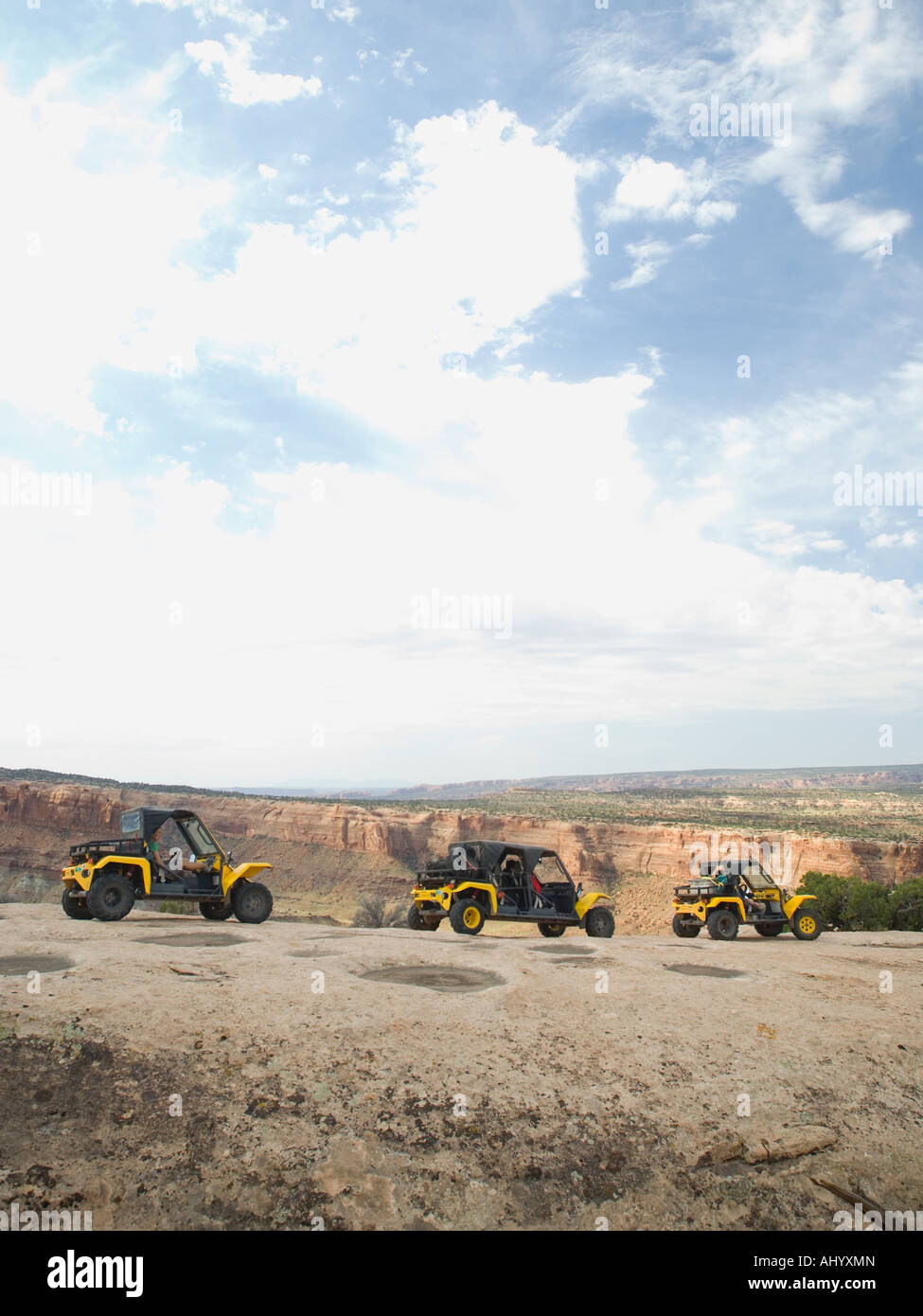 People in off-road vehicles on rock formation Stock Photo - Alamy