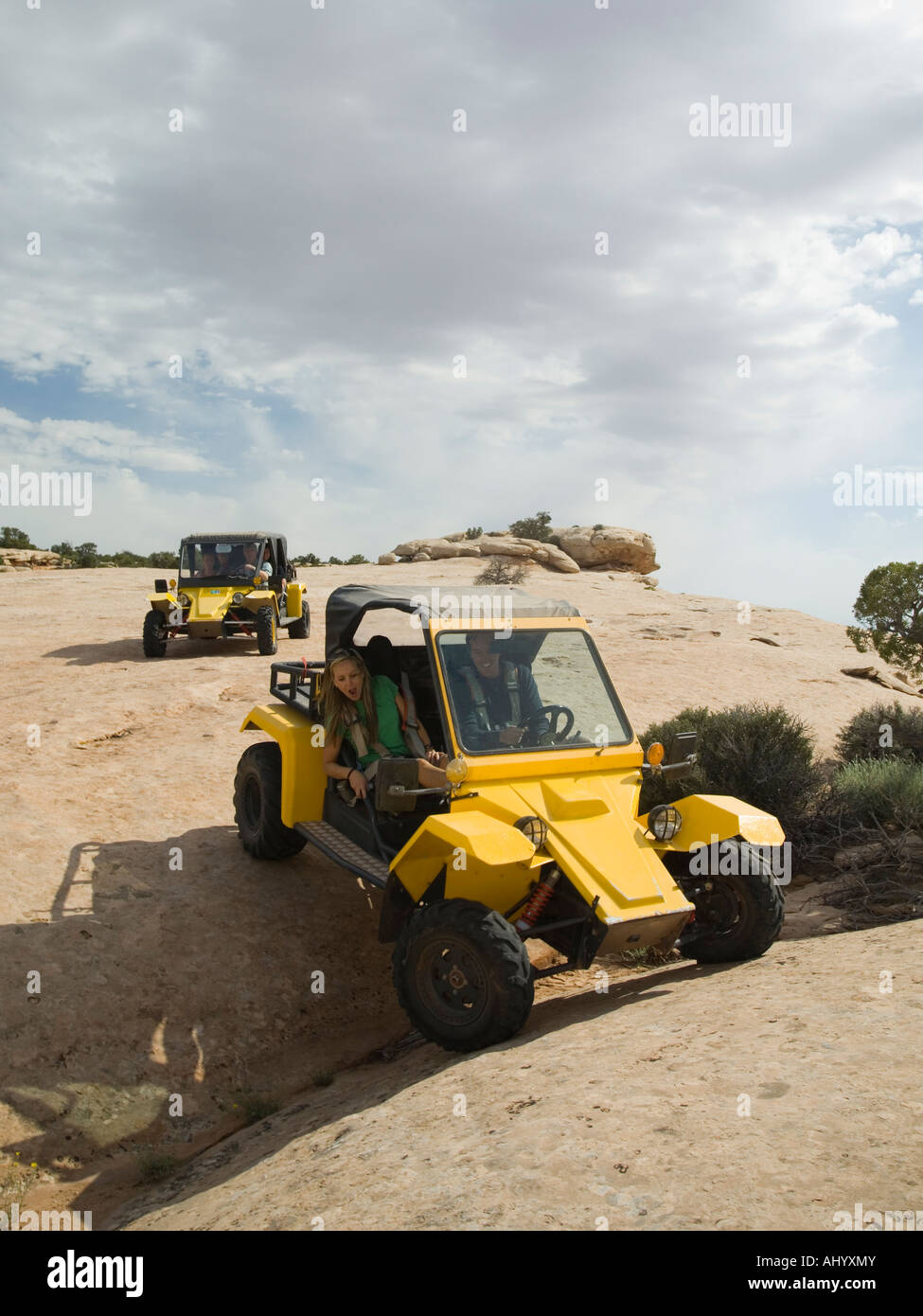 People in off-road vehicles on rock formation Stock Photo - Alamy