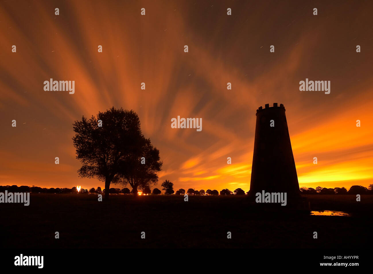 The old black mill towers over the Beverley westwood common under a ...