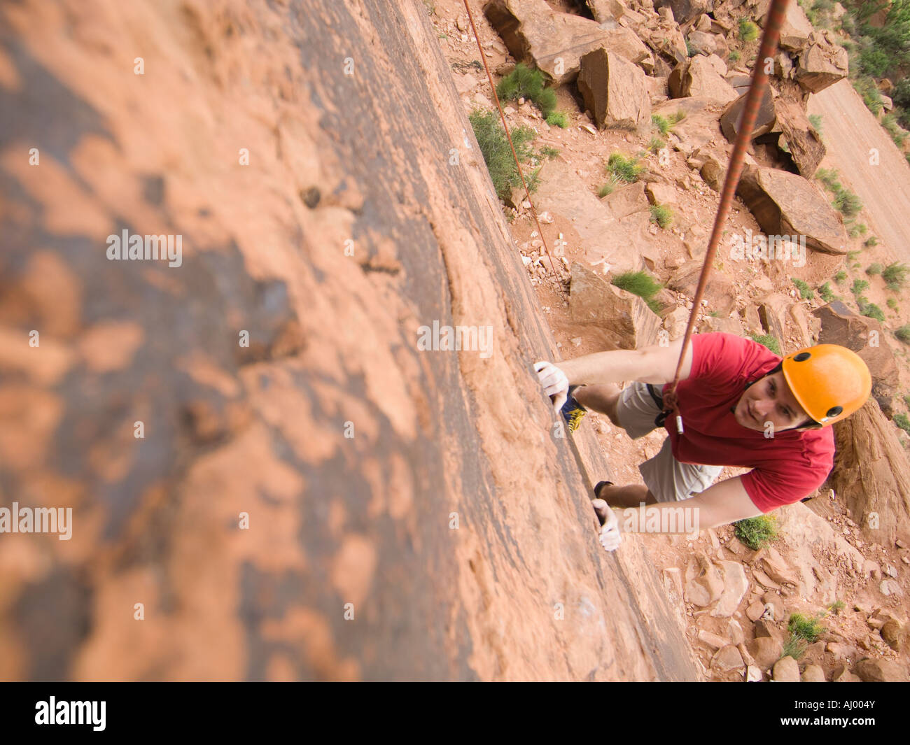 Man rock climbing Stock Photo - Alamy