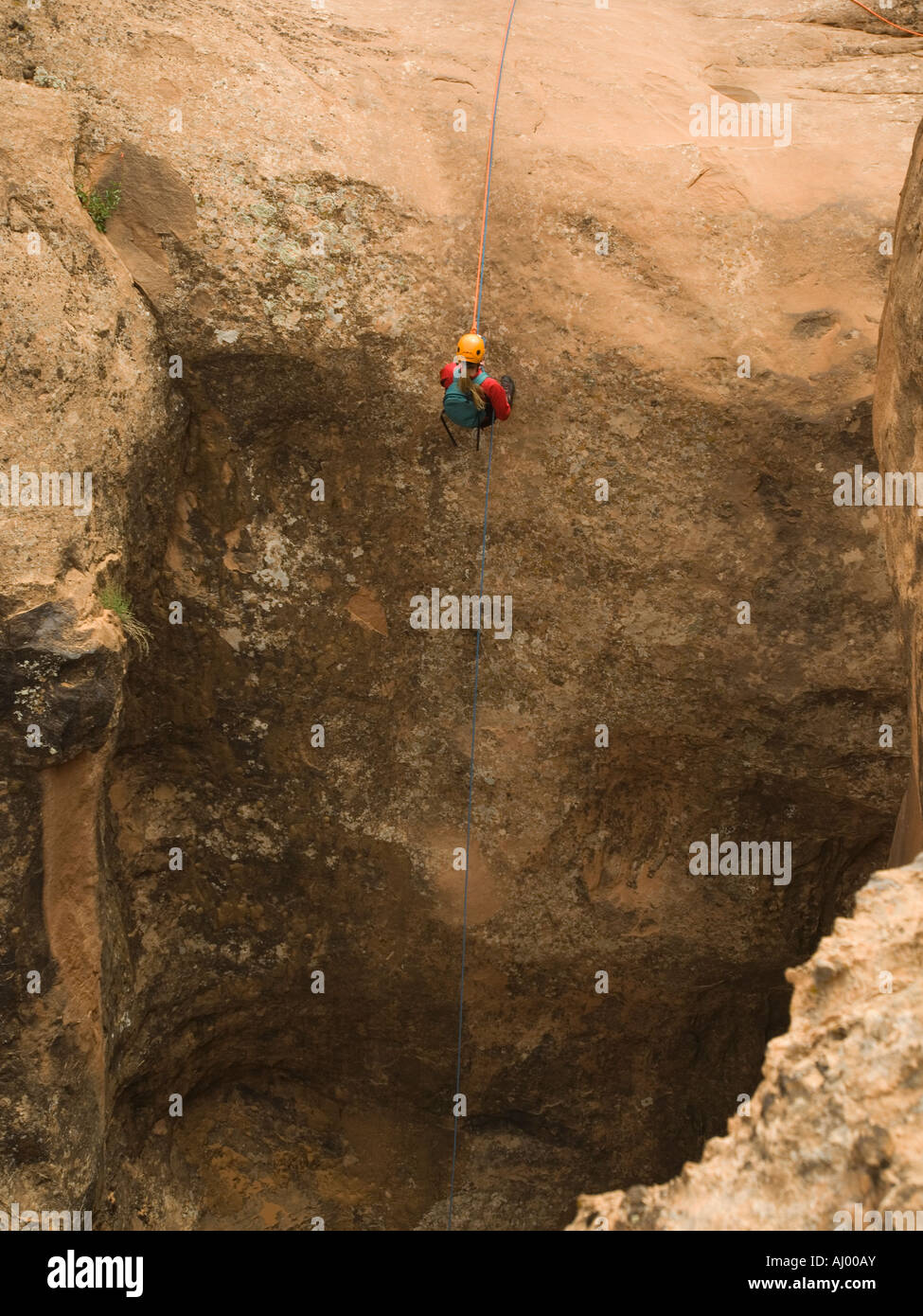 Man canyon rappelling Stock Photo - Alamy