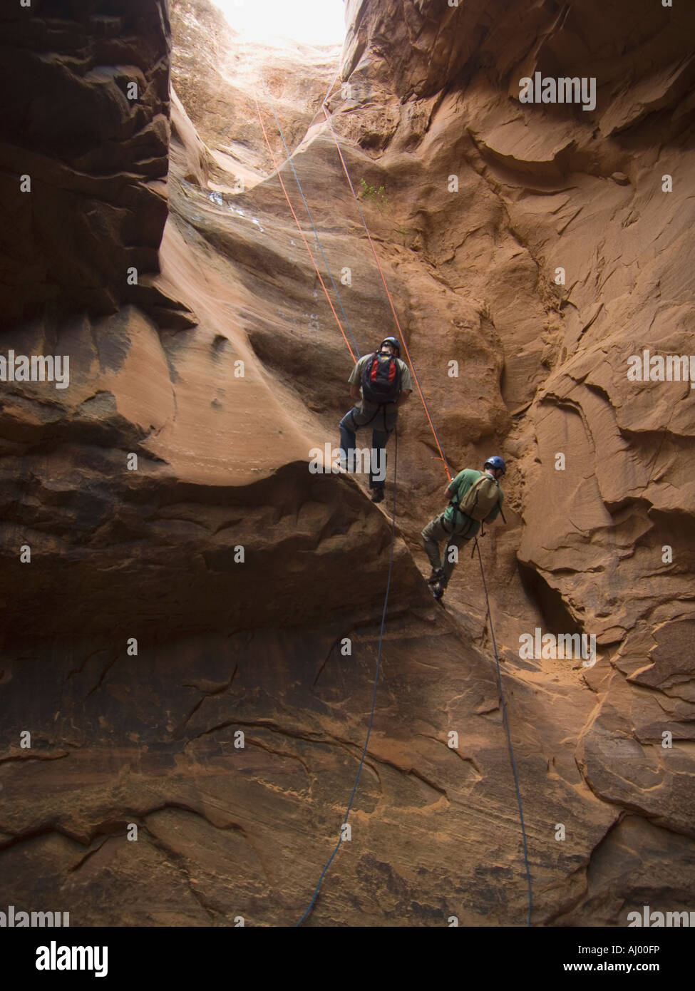 People canyon rappelling Stock Photo - Alamy