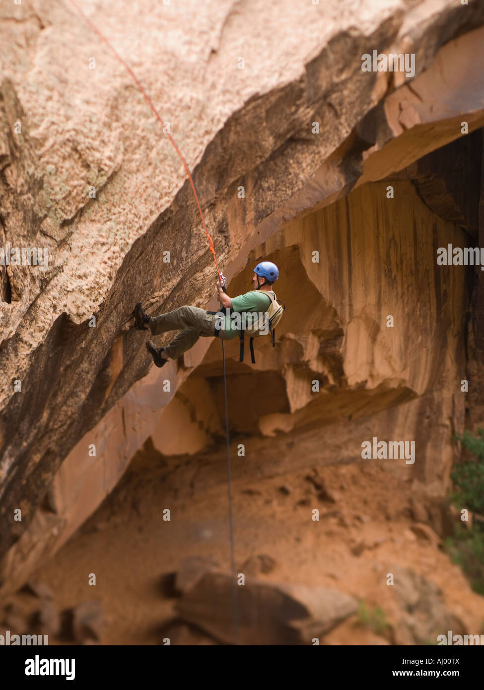 Man canyon rappelling Stock Photo - Alamy