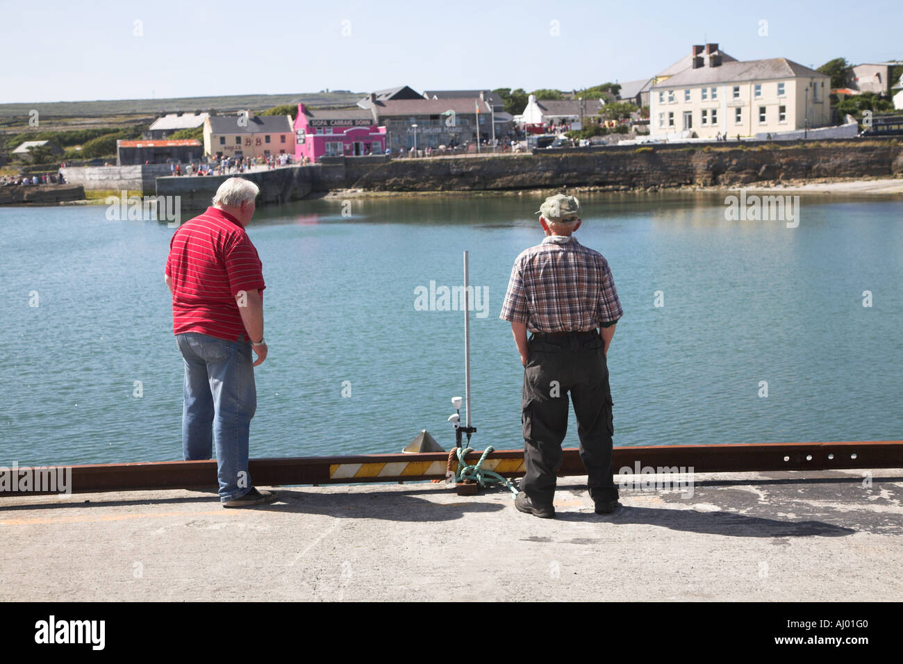 Two old men kilronan harbour and village aran islands hi-res stock ...