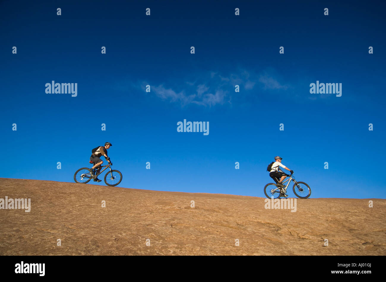 People riding mountain bikes Stock Photo - Alamy