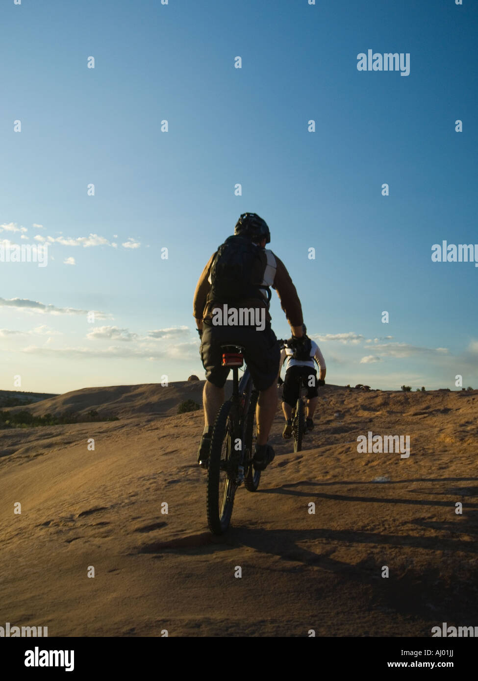 People riding mountain bikes Stock Photo - Alamy