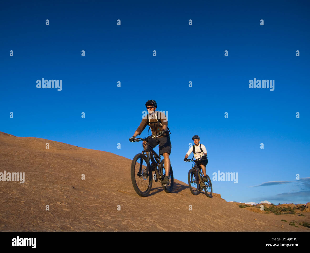 People riding mountain bikes Stock Photo - Alamy