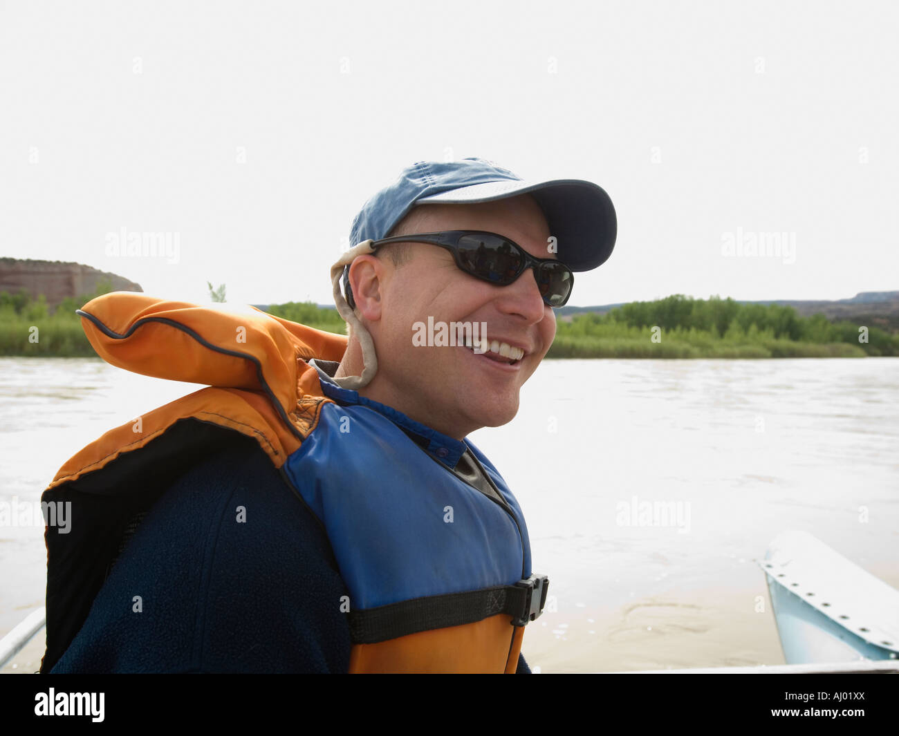 Man wearing lifejacket Stock Photo - Alamy