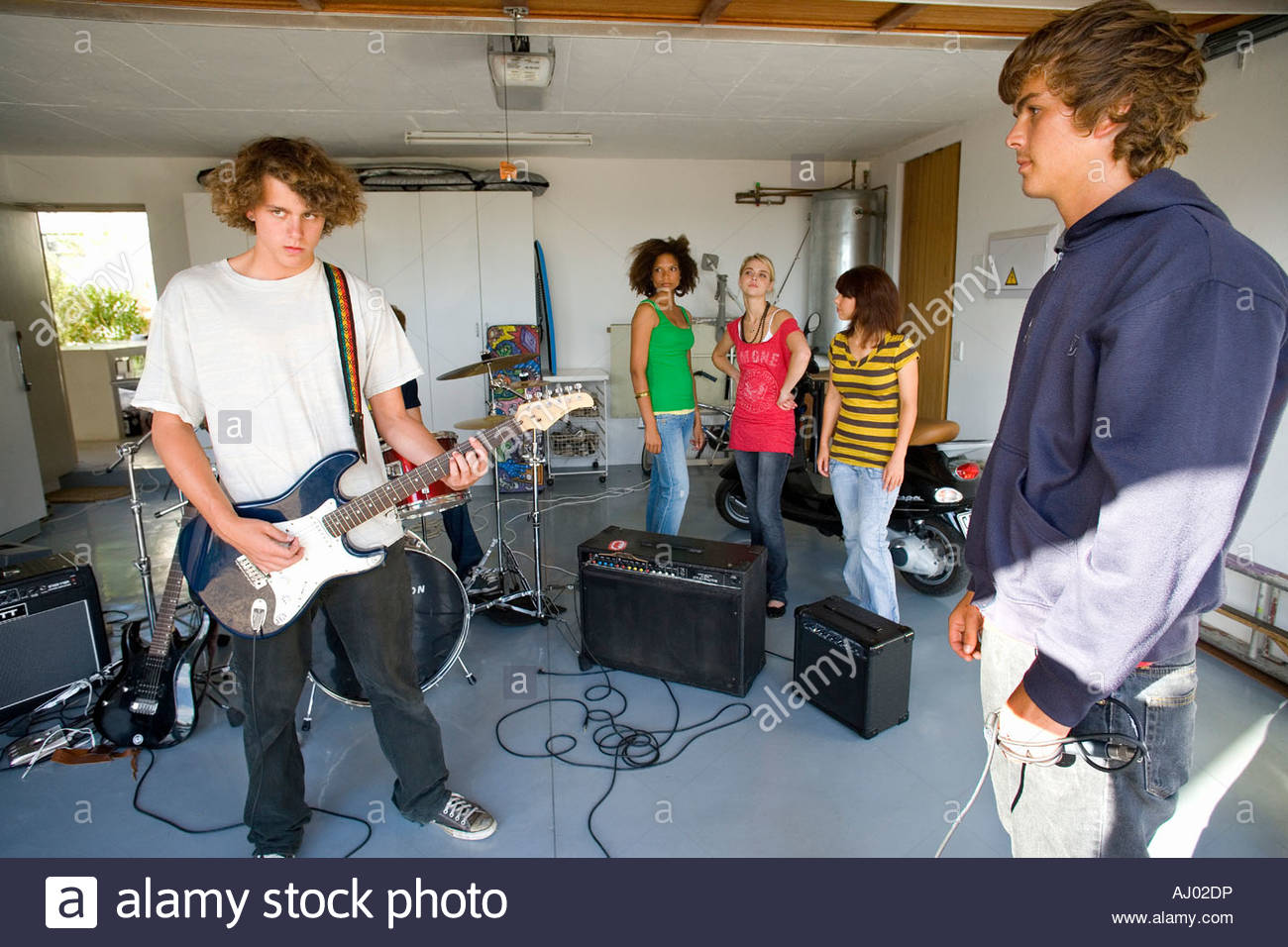Group of teenagers playing in garage band Stock Photo: 14576961 - Alamy