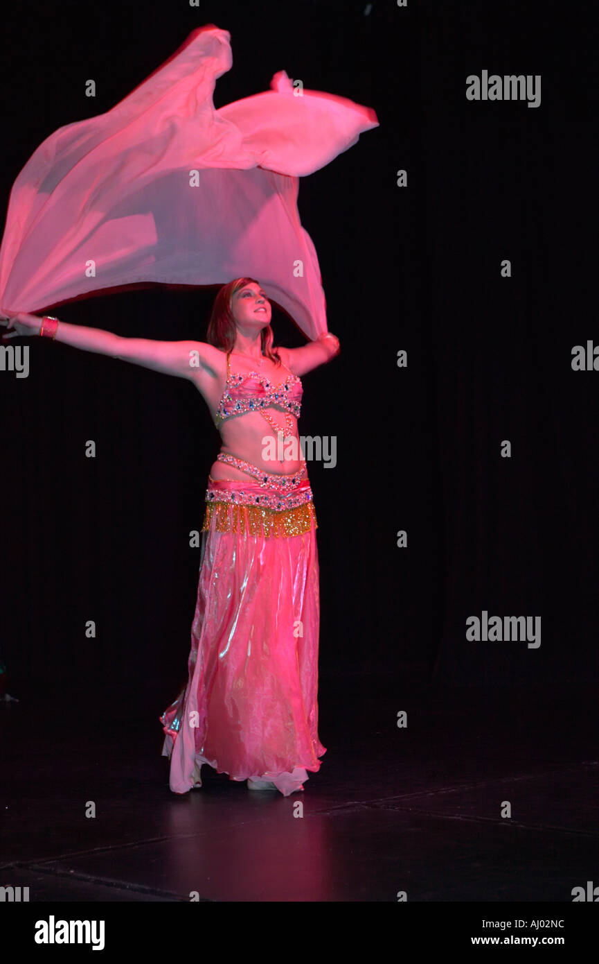 belly dancer performing on stage veil dance Stock Photo - Alamy