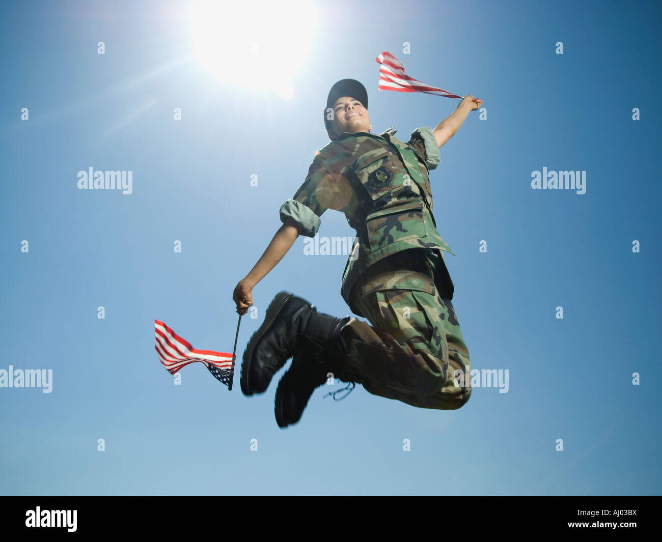 Female army soldier jumping Stock Photo - Alamy