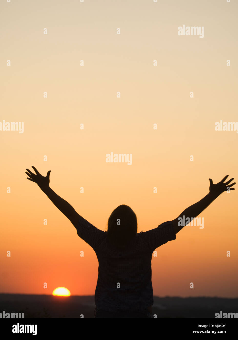 Person with arms raised Stock Photo - Alamy