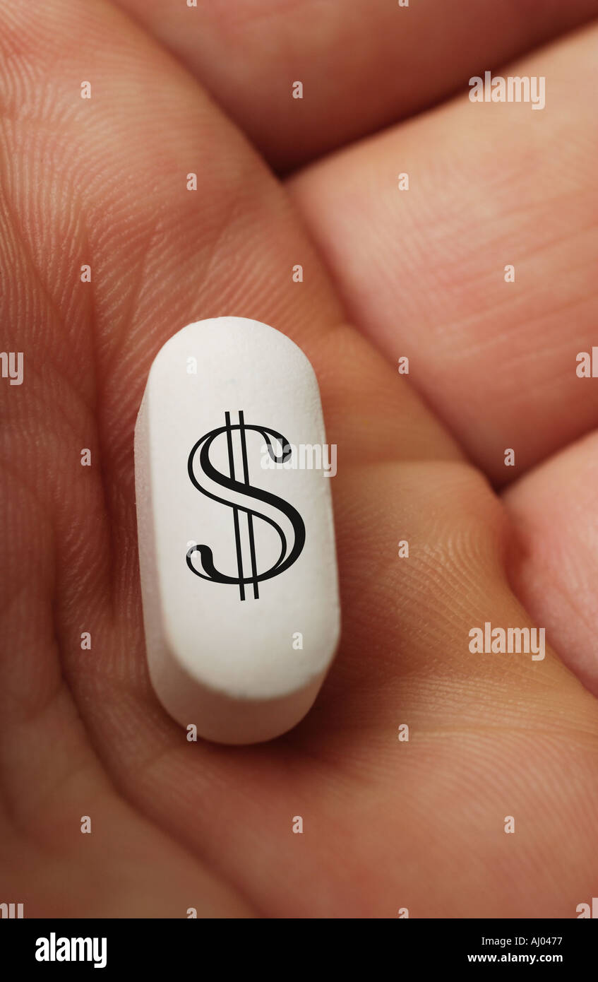 Pill with dollar sign on hand Stock Photo - Alamy