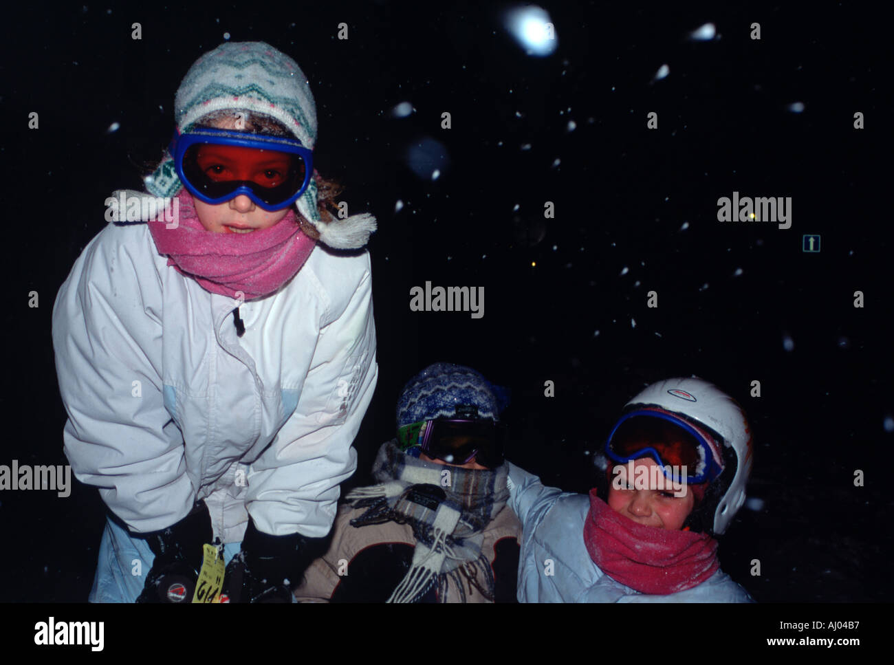 Three children in blizzard at night aged nine seven and three Stock ...
