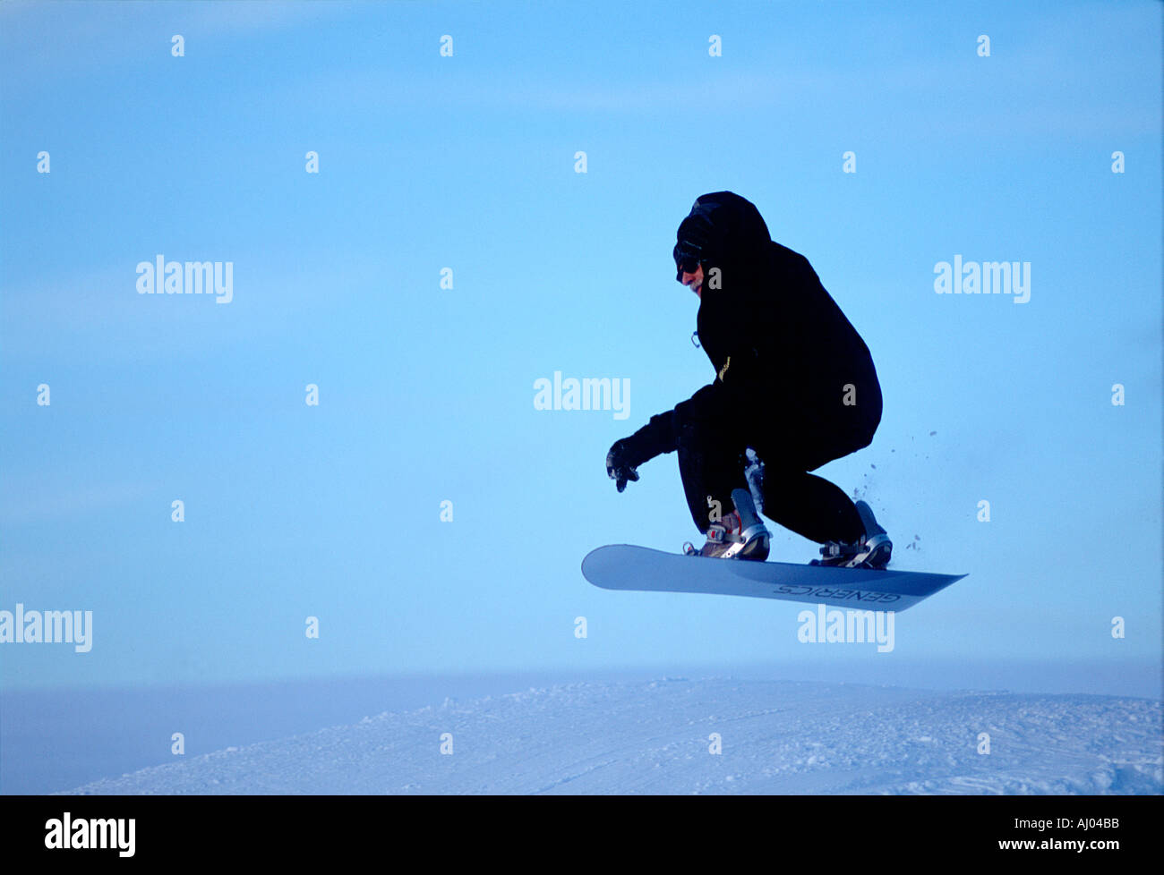Man aged early sixties performs snowboard jump at Bozi Dar krusne hory ...