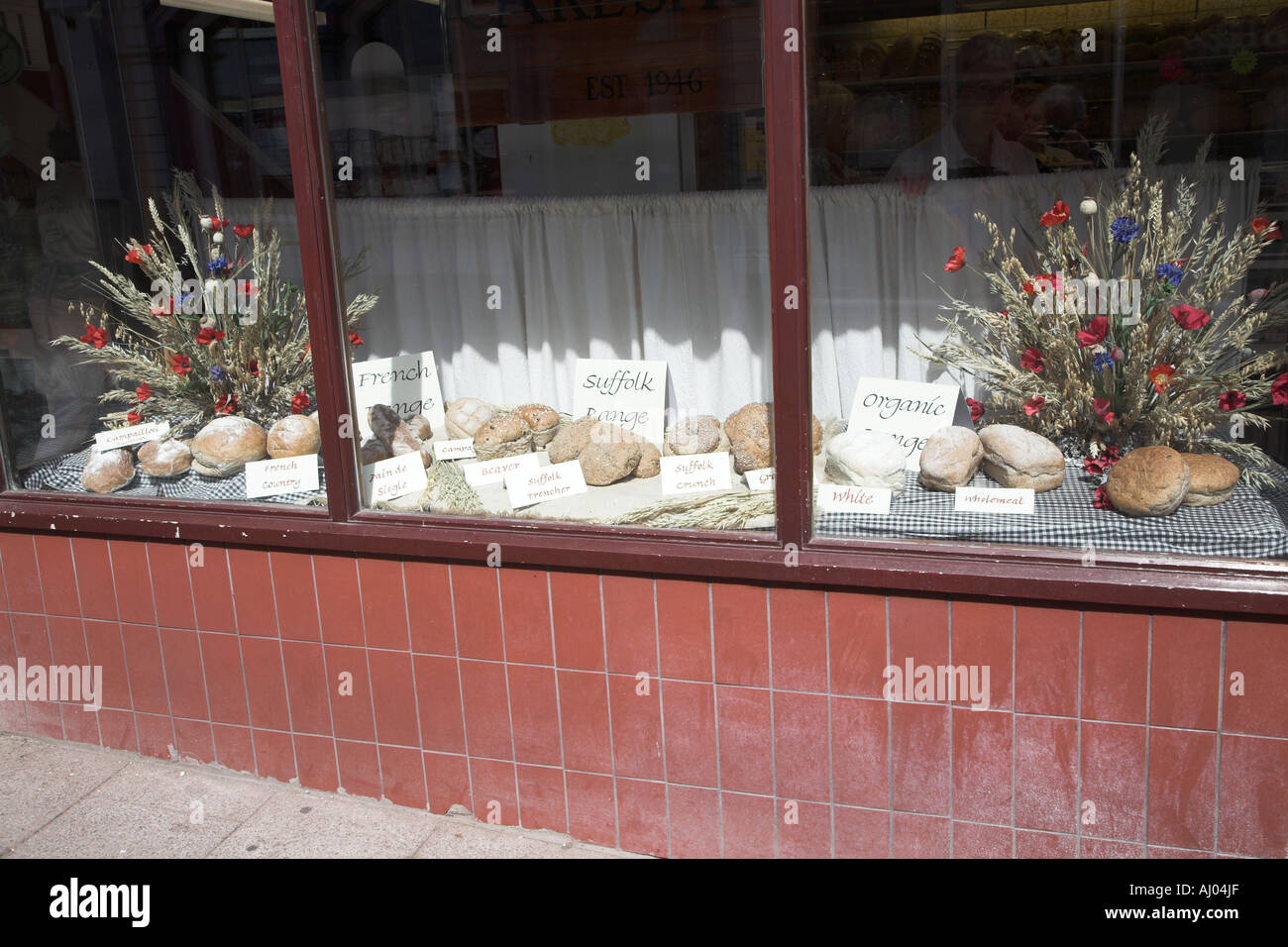Display of specialist breads in baker shop window Stock Photo - Alamy